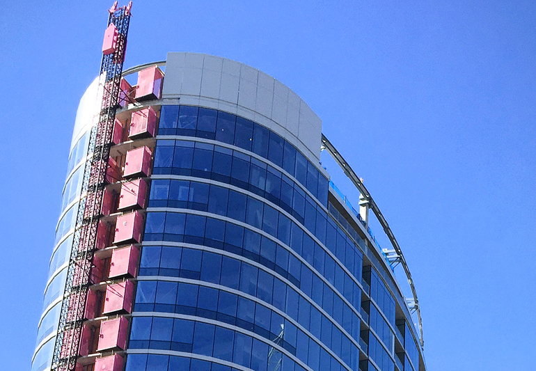 Parapet atop apartment tower generating debate about finished product ...