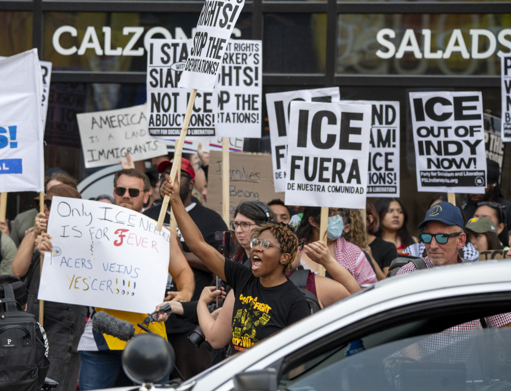 Hundreds of protestors opposed to ICE raids gather downtown before NBA ...